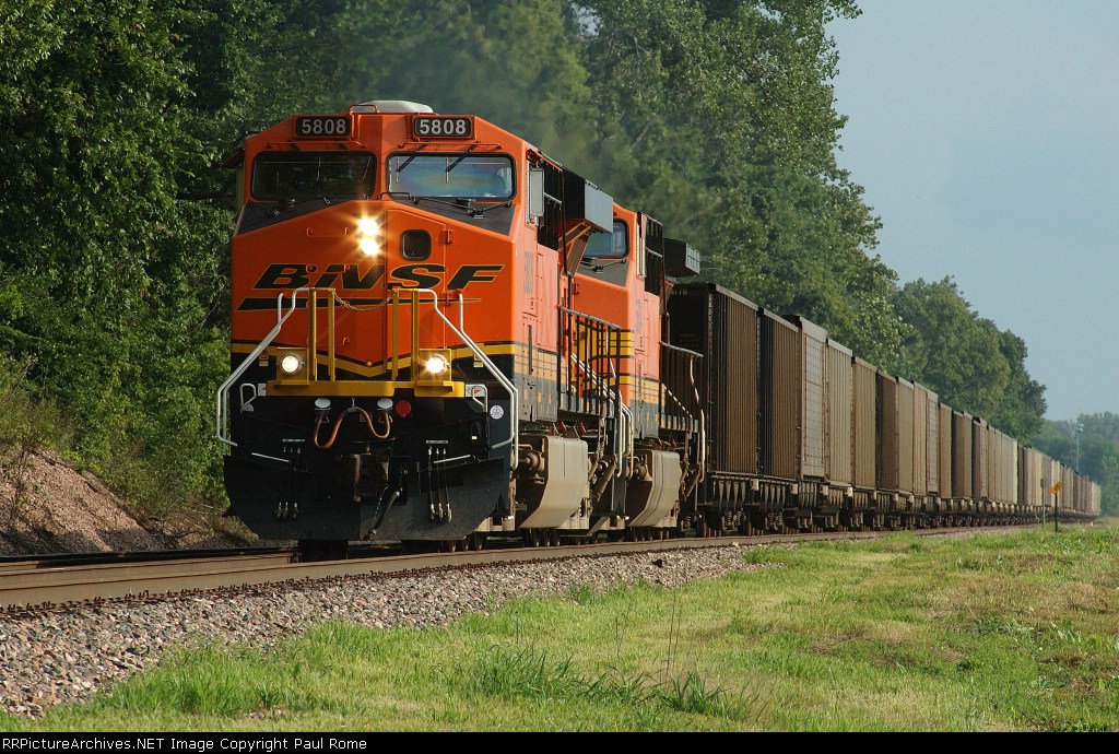 BNSF 5808, ES44AC GEVO leads an empty hopper westbound
